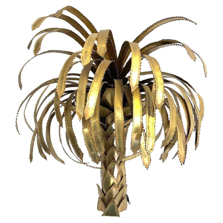 A 1970s Maison Jansen torch cut brass palm tree wall light at 1stDibs
