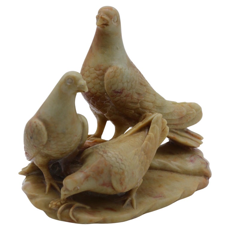 A 19th century Chinese soapstone carved figure group of three pigeons ...