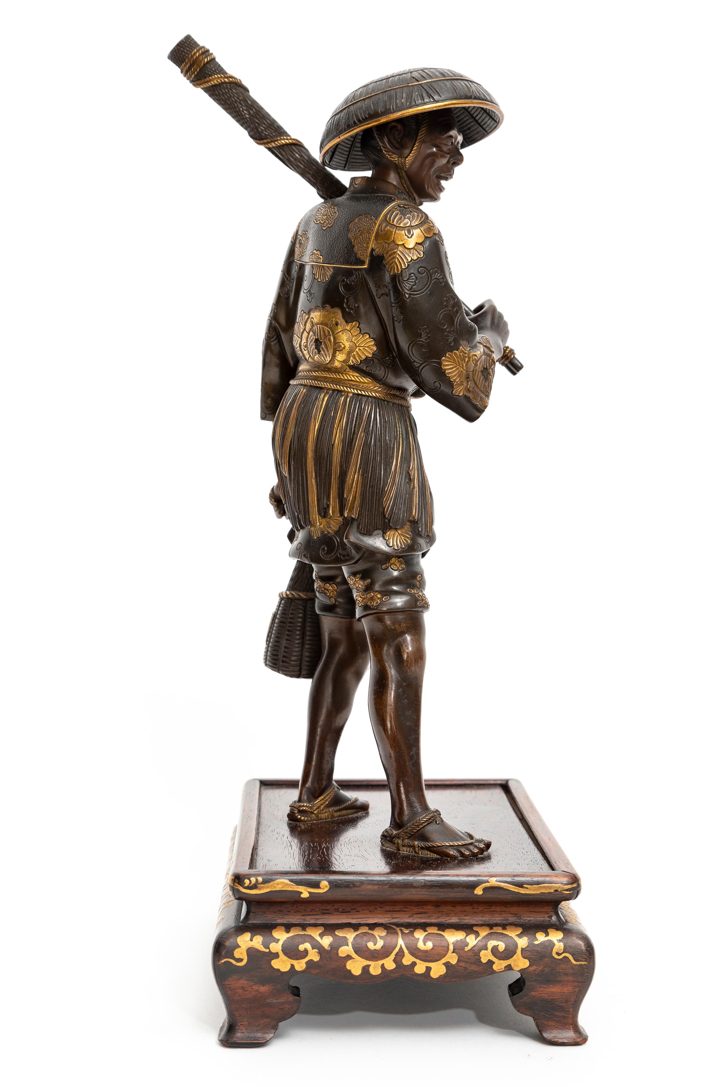 A 19th Century Japanese Patinated and Gilt Bronze Model of a Fisherman ...