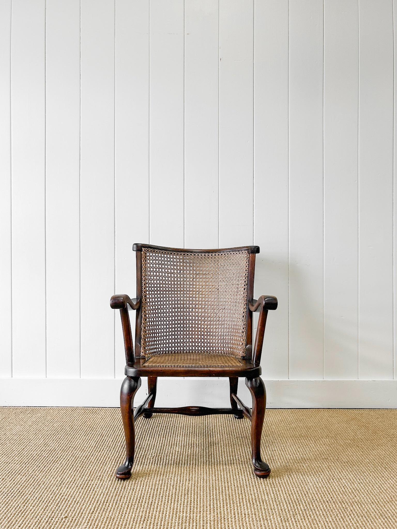 A 19th Century Mahogany Anglo-Indian Caned Arm Chair For Sale at 1stDibs