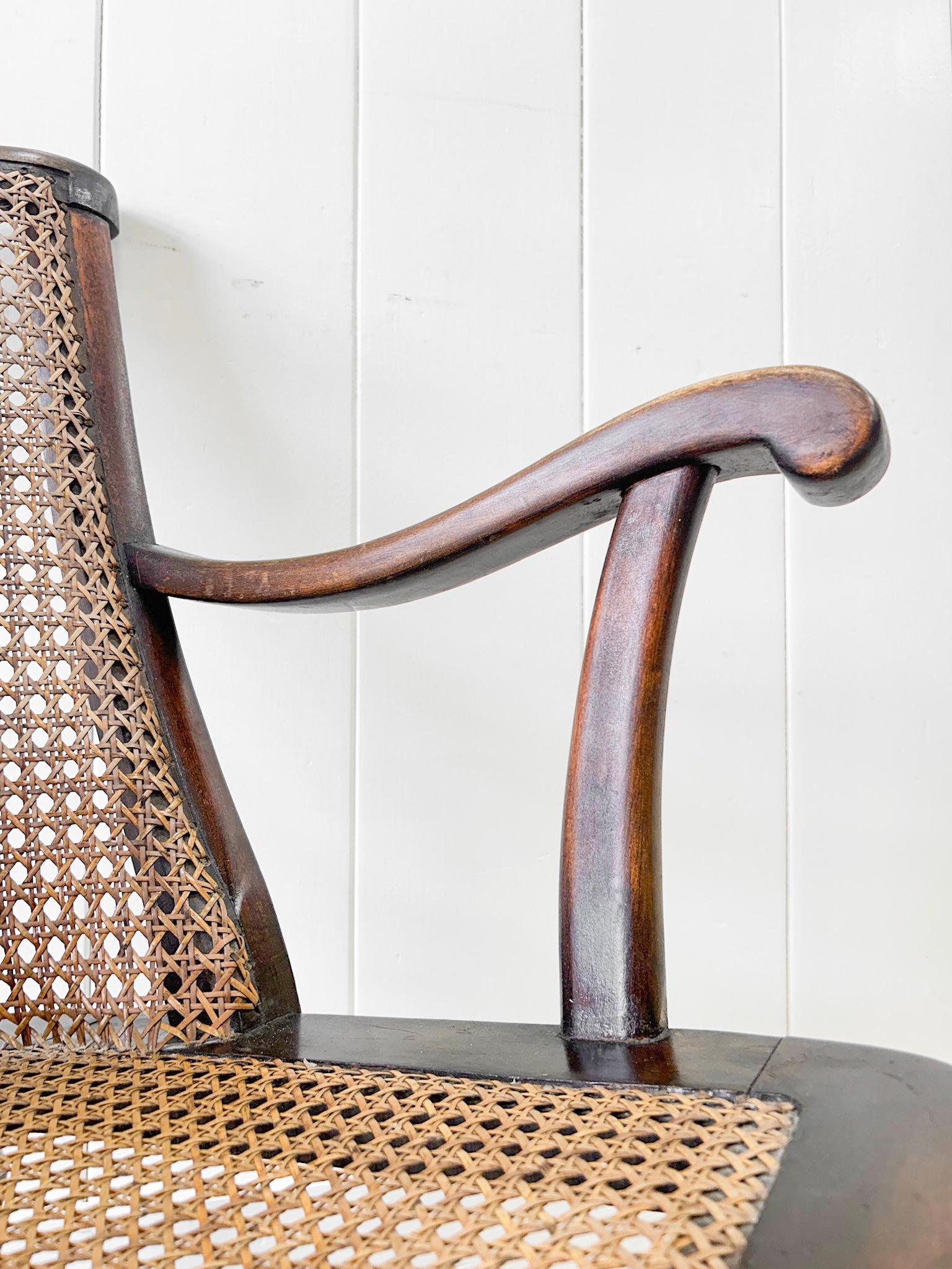 A 19th Century Mahogany Anglo-Indian Caned Arm Chair For Sale at 1stDibs