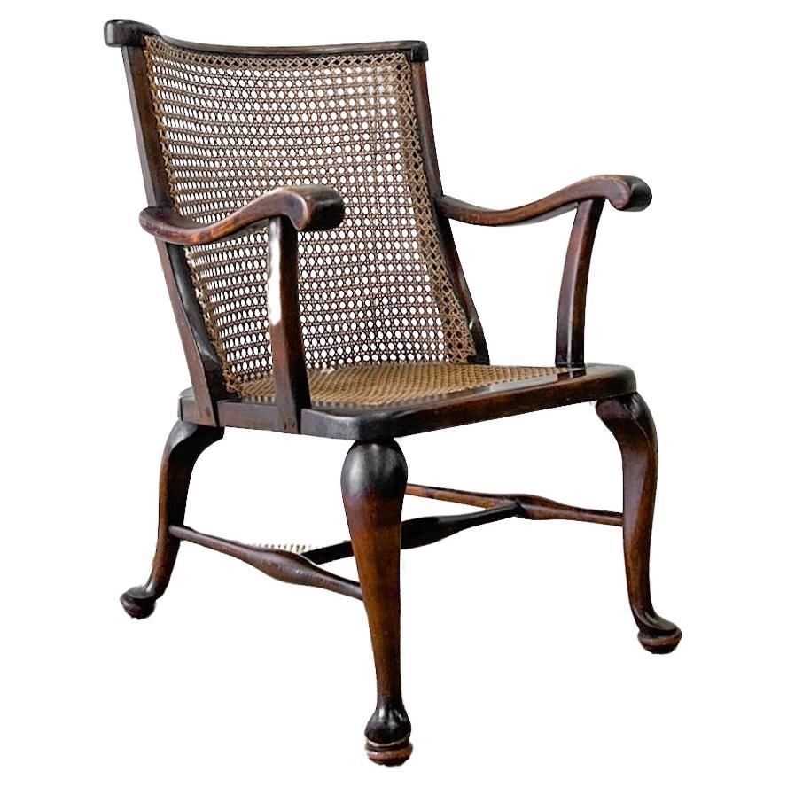 A 19th Century Mahogany Anglo-Indian Caned Arm Chair For Sale at 1stDibs