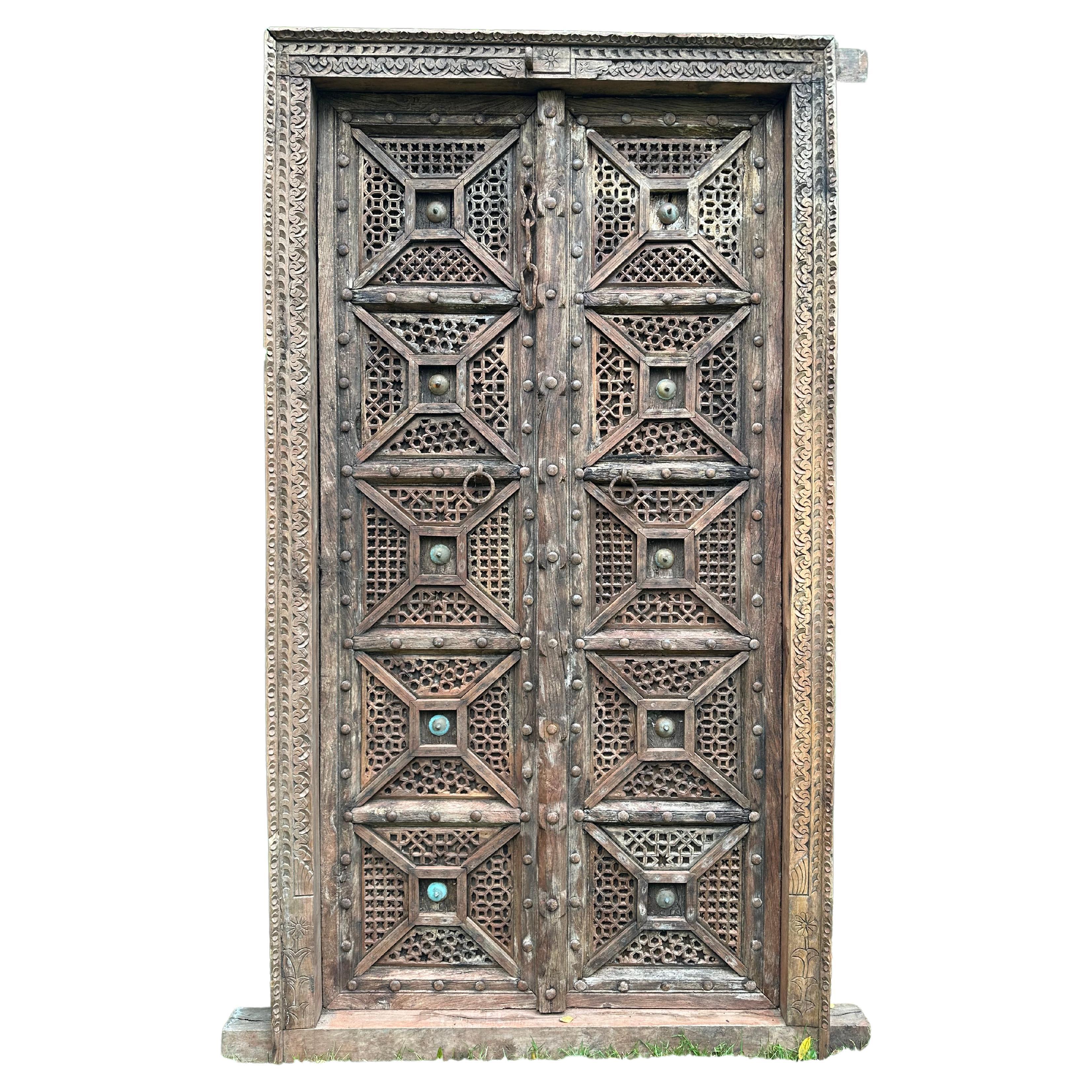 A 19th century pair of rustic Indian doors. For Sale at 1stDibs