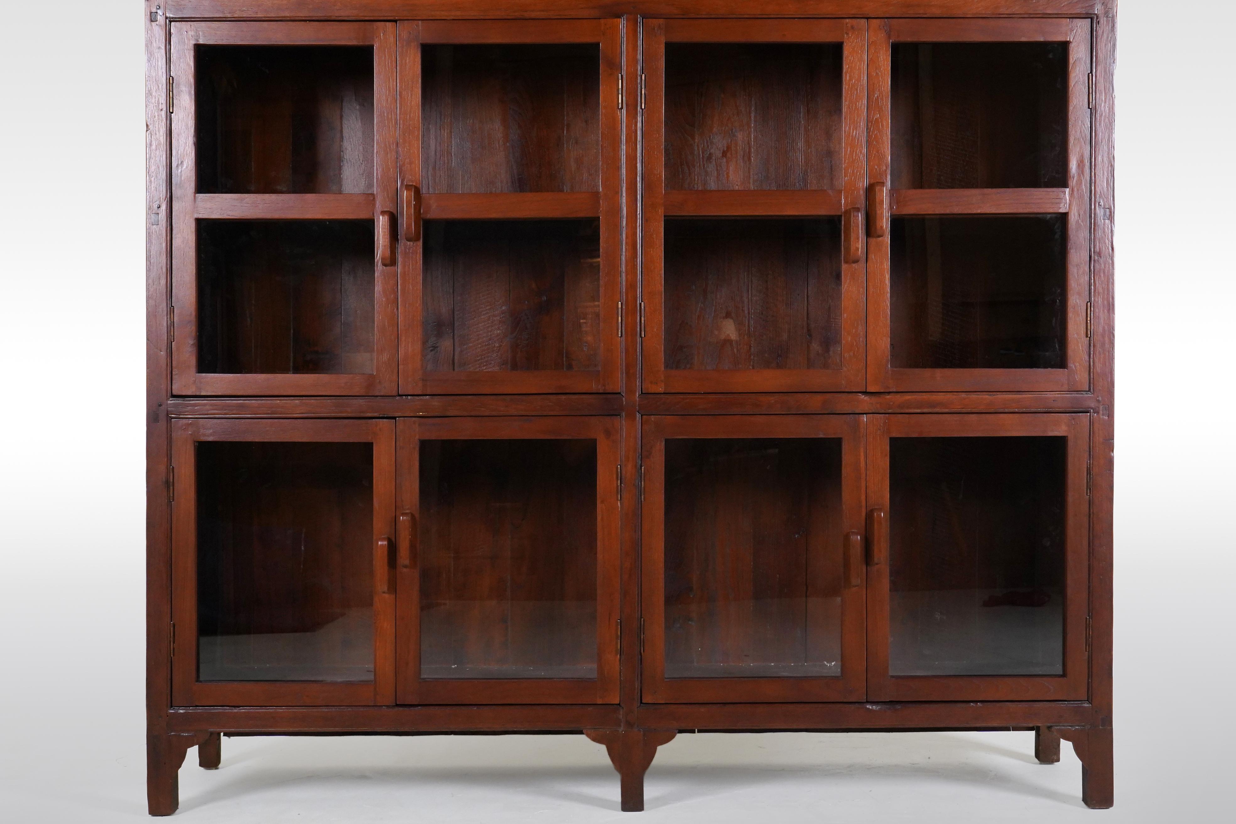 A British Colonial Teak Wood Bookcase For Sale at 1stDibs