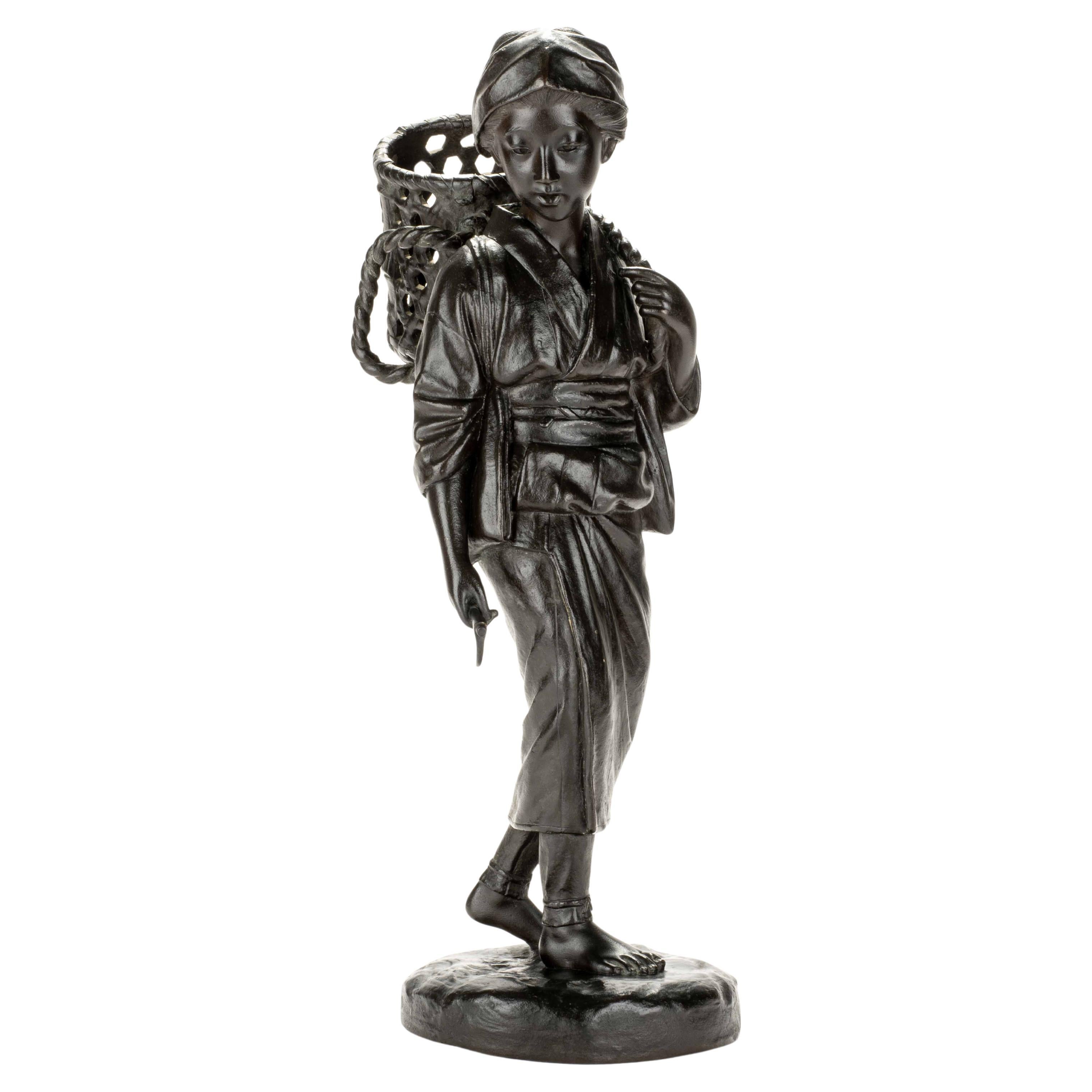 A bronze okimono depicting a walking peasant woman For Sale at 1stDibs