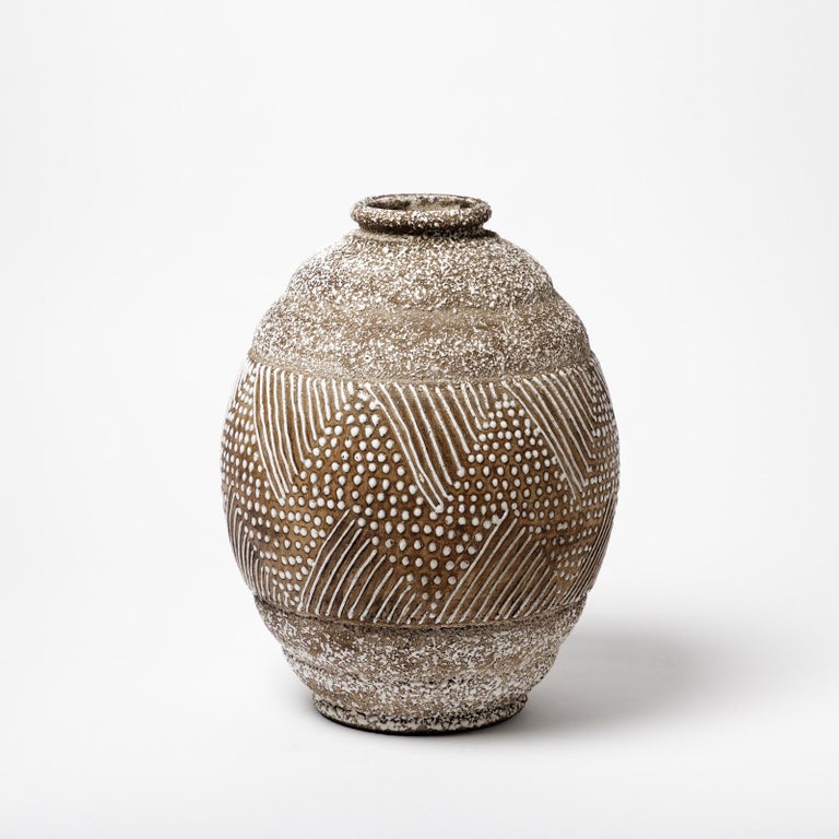 A ceramic vase with glaze decoration, circa 1930 in the style of Jean ...