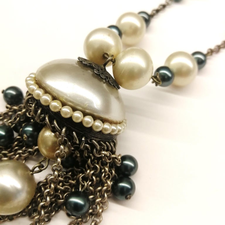 A cream, grey faux pearl and chain 'tassel' sautoir, att. Rousselet ...