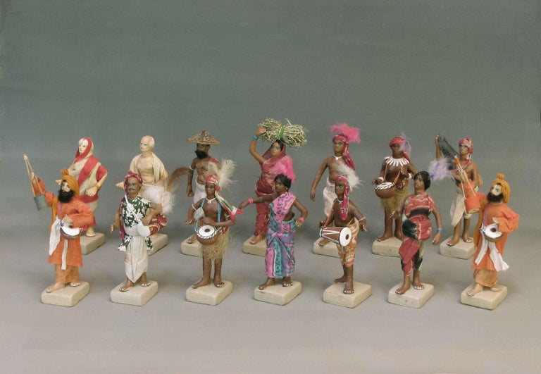 Group of Fourteen Indian Painted Terracotta and Cotton Dressed Figures ...