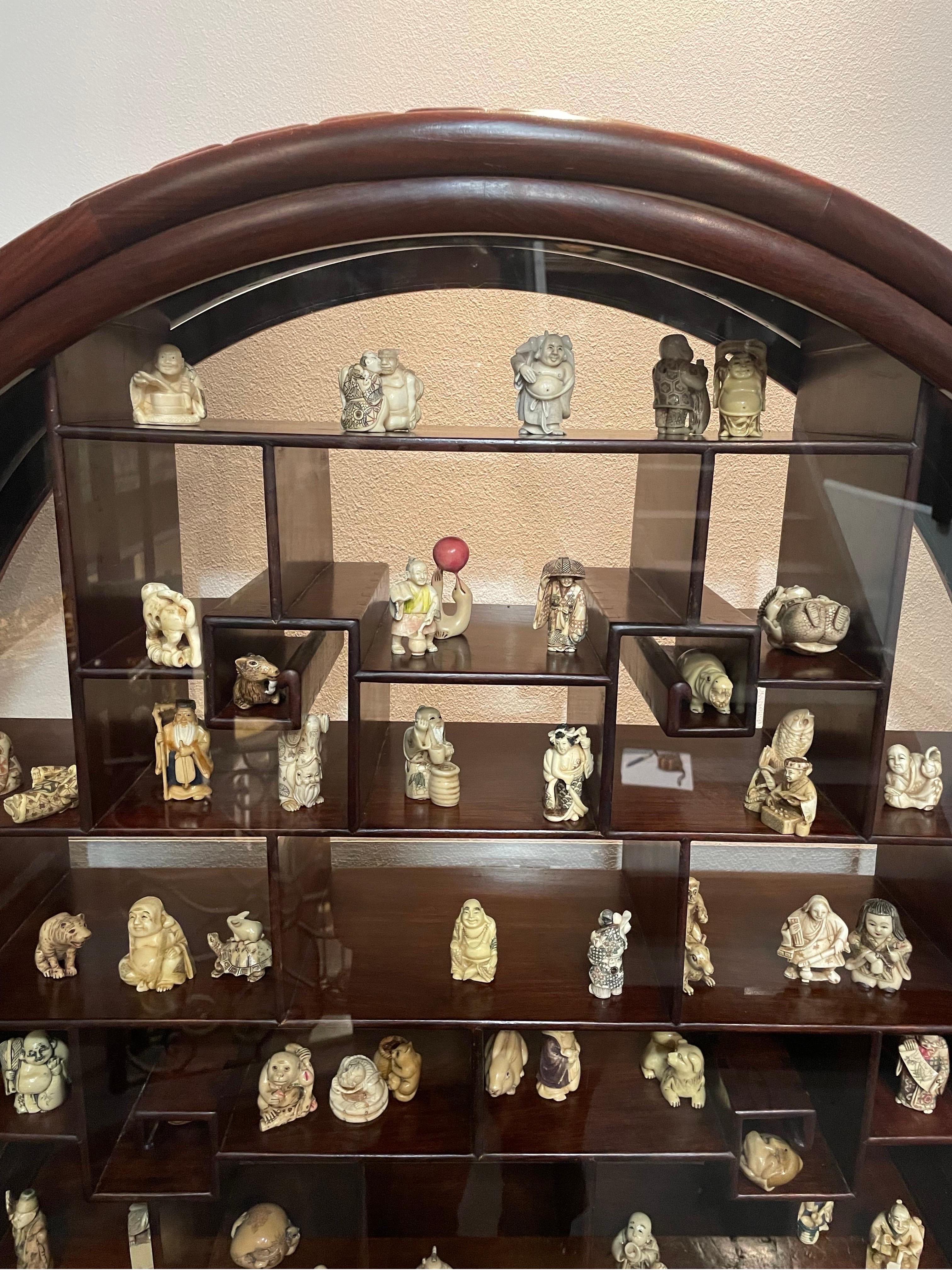 A Hardwood Moon Shape Display Cabinet, 20th century For Sale at 1stDibs