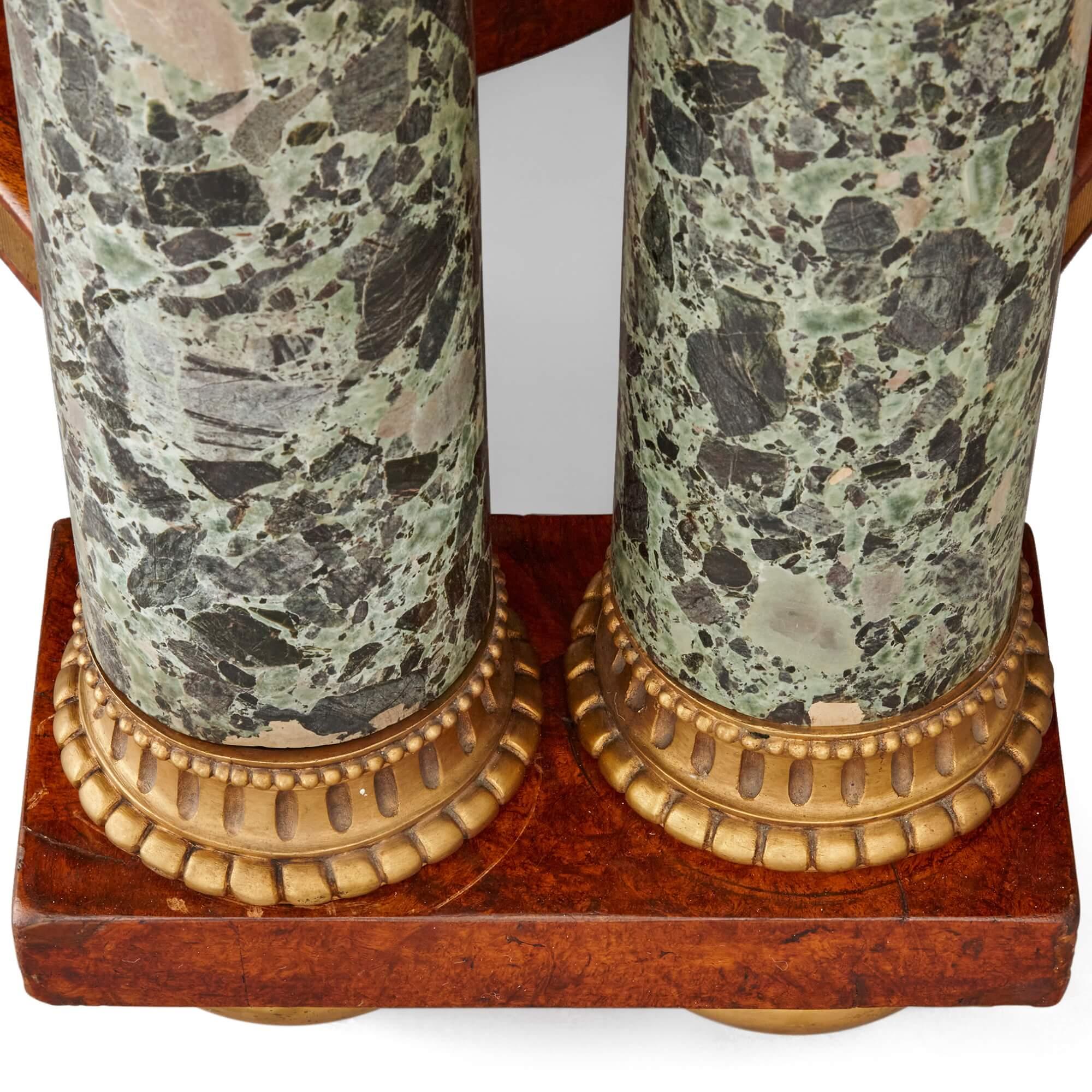 A large amboyna, stained glass, marble, and ormolu mounted centre table ...