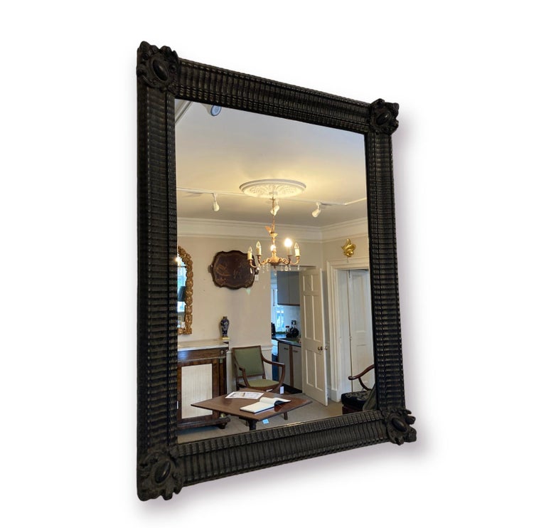 A large Flemish ebonised carved wood ripple frame mirror For Sale at ...