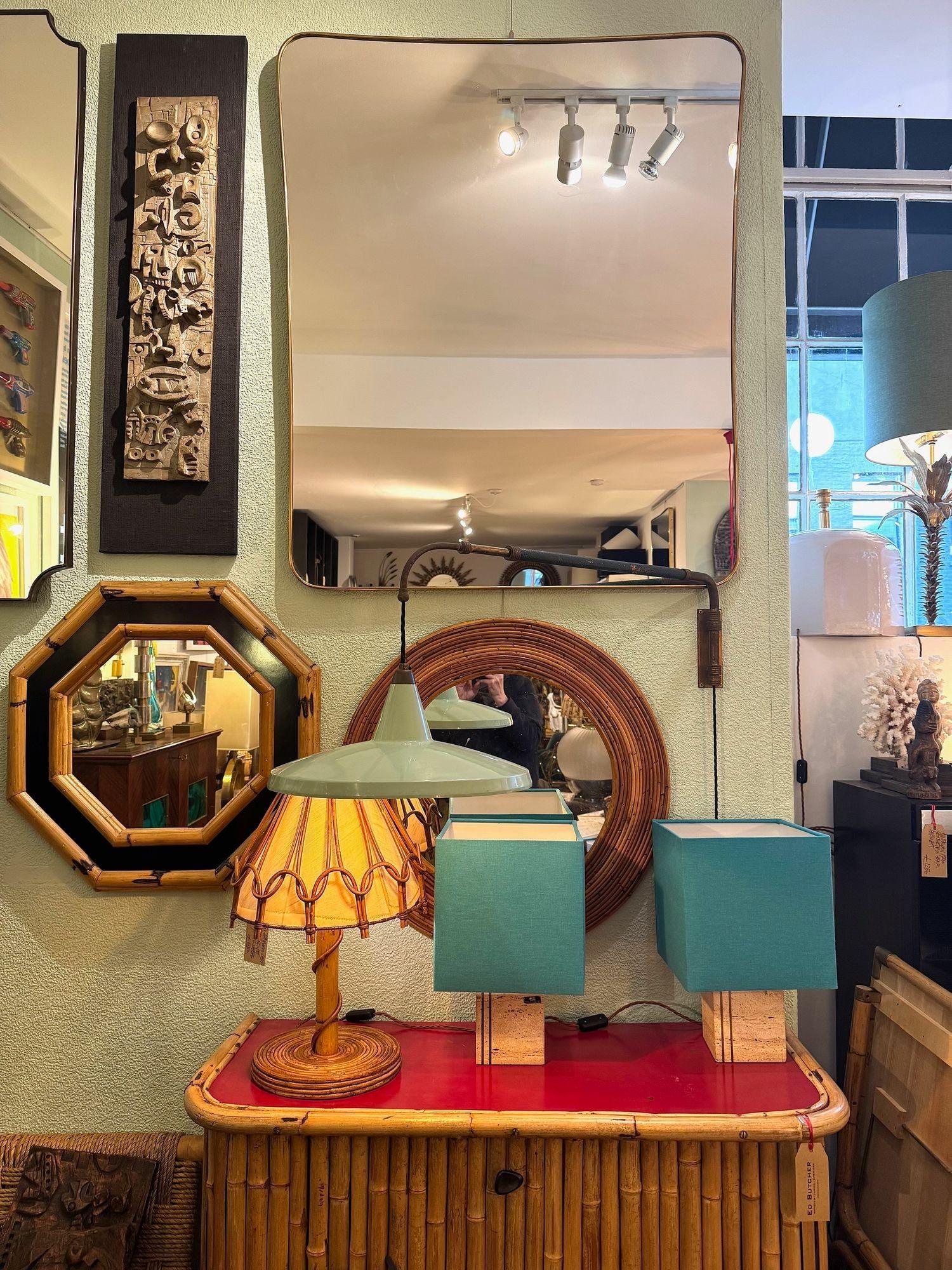 A large orignal 1950s Italian brass framed mirror with wide proportions ...