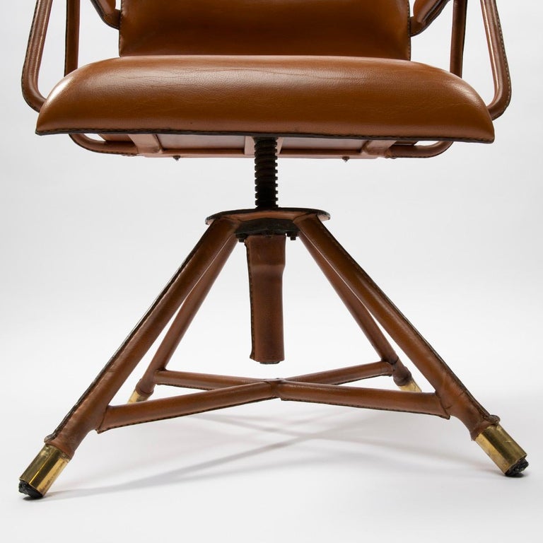 Jacques Adnet Cognac Saddle Stitched Leather Swivel Chair At 1stdibs