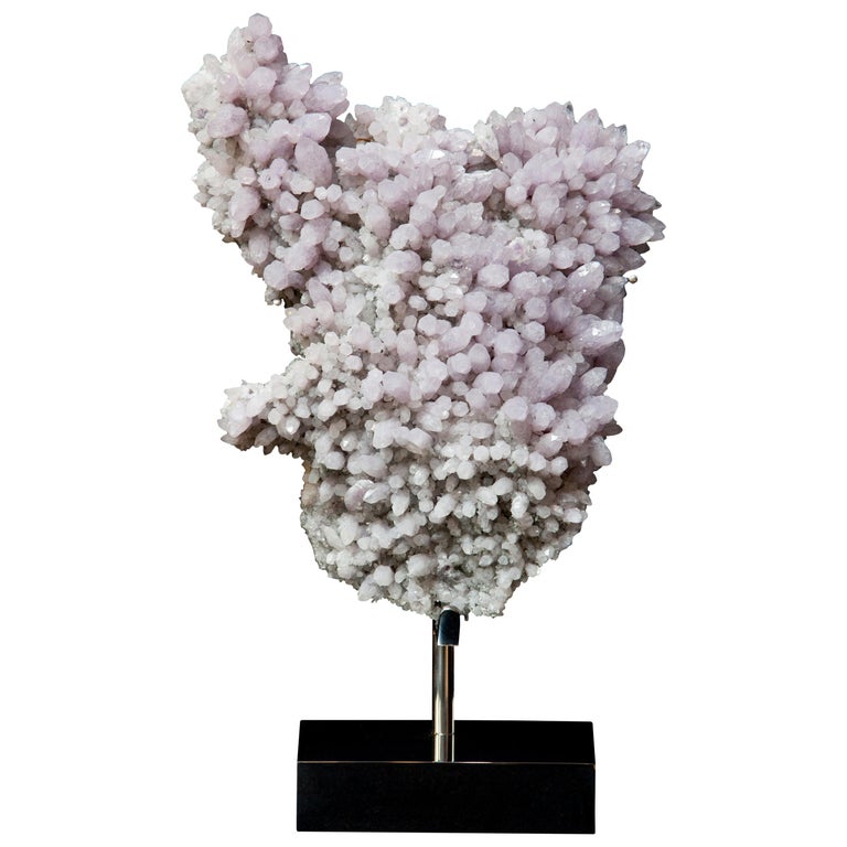 A lilac Amethyst Crystal Cluster mounted onto a mirrored steel base at ...