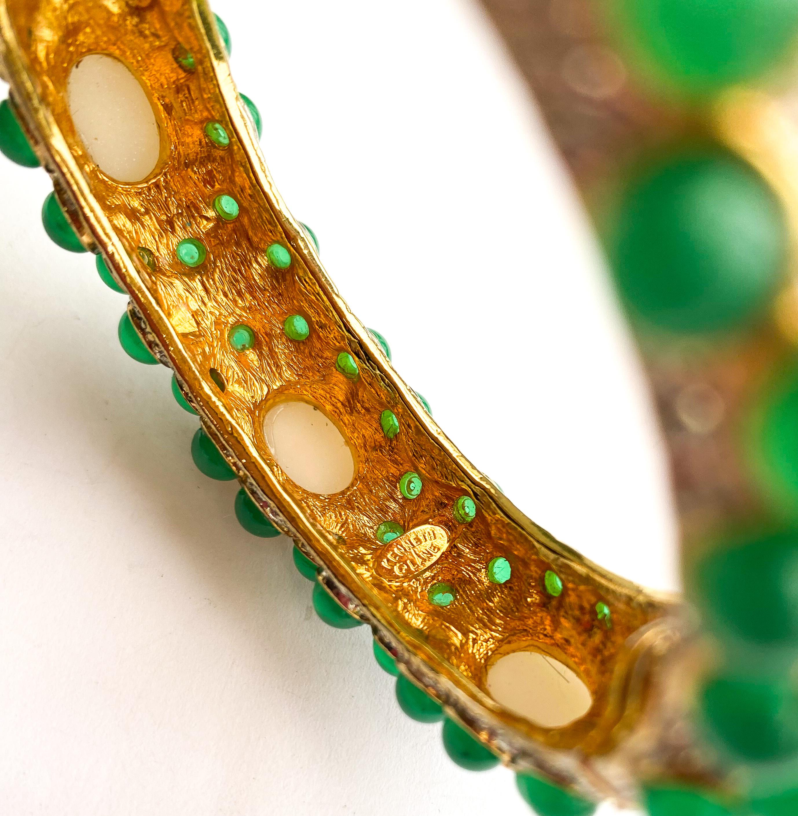 A Moghul-style clear and emerald paste bangle, Kenneth Lane, USA ...