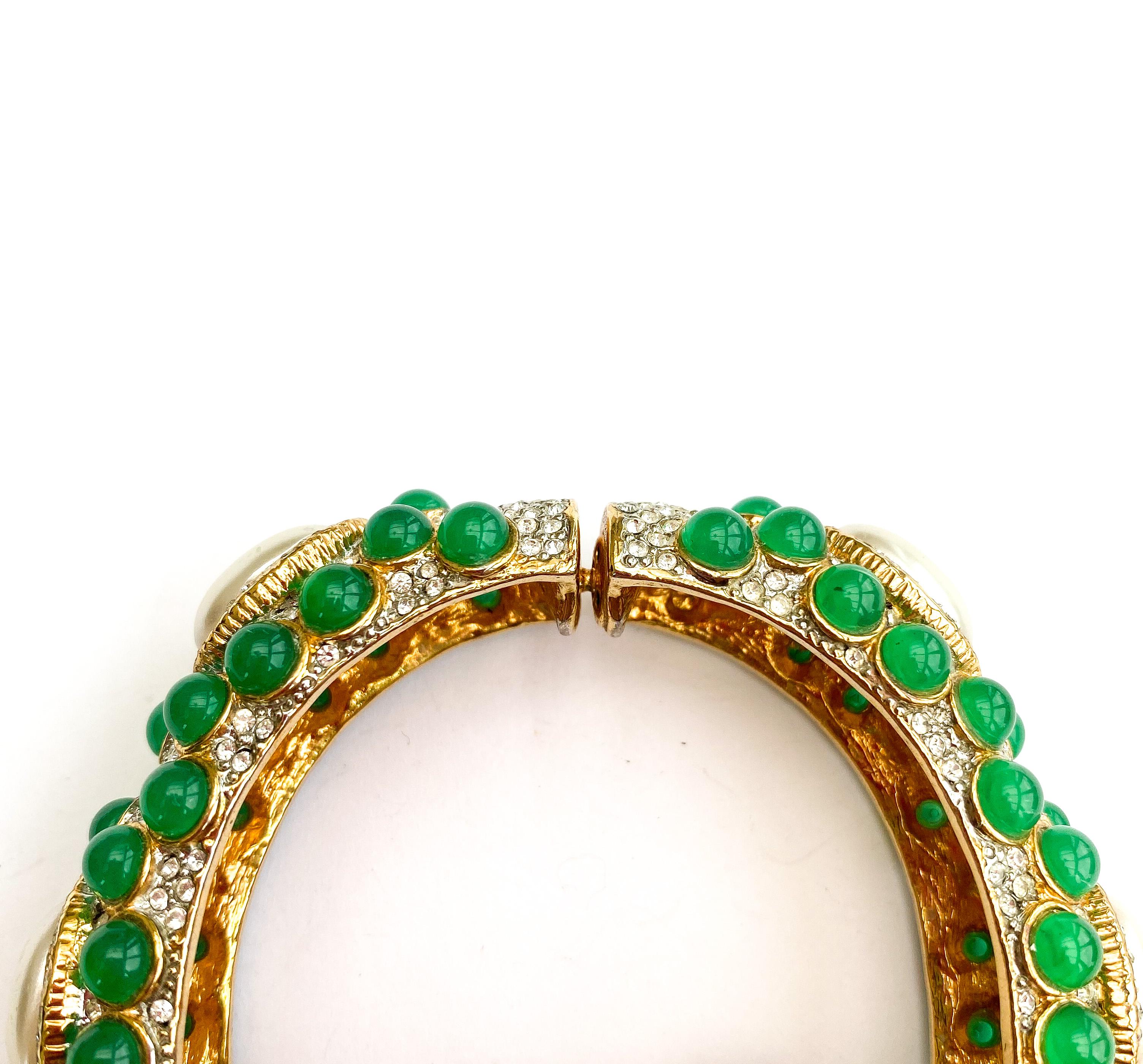 A Moghul-style clear and emerald paste bangle, Kenneth Lane, USA ...