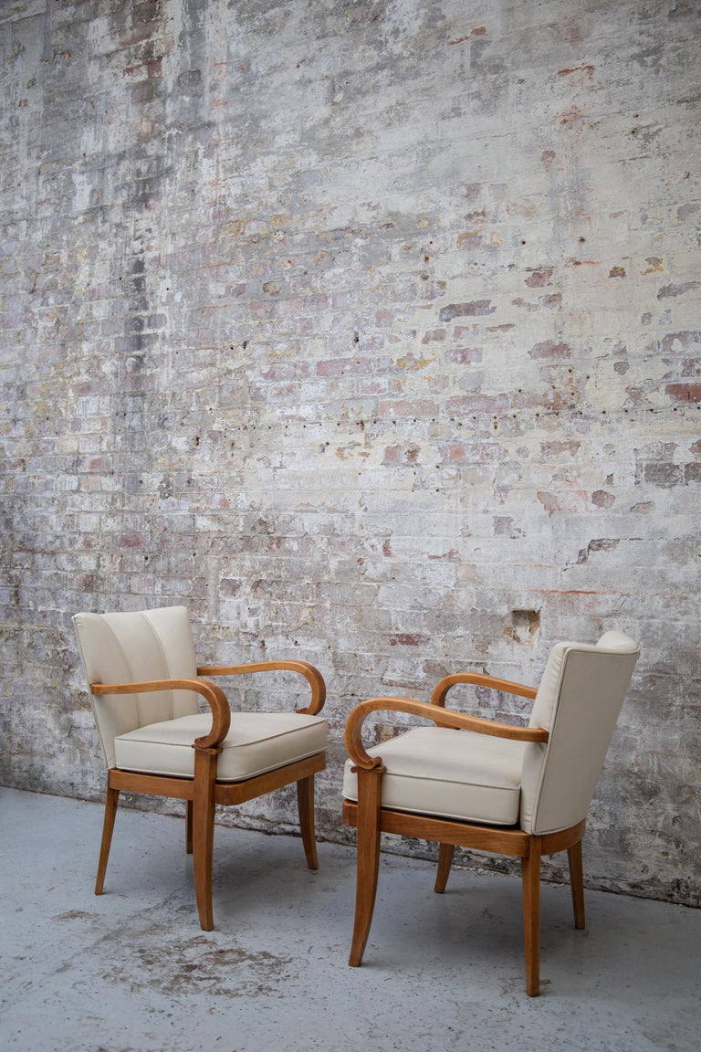 A Pair of Cherrywood Armchairs attributed to Etienne-Henri Martin ...