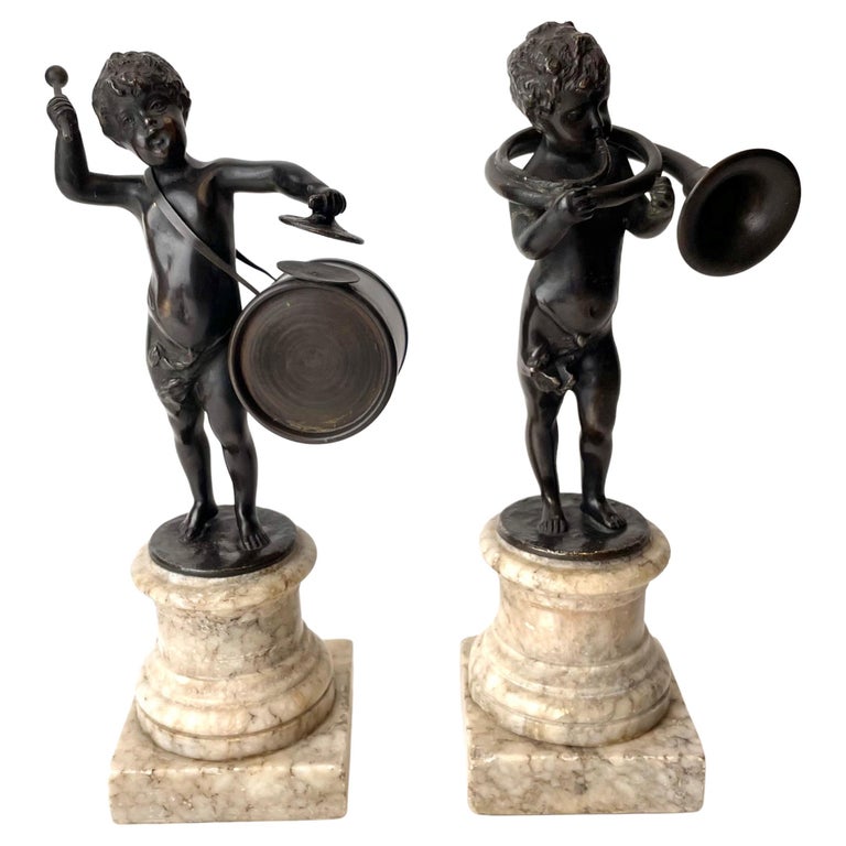 A pair of Cupids playing instruments in patinated Bronze from early ...