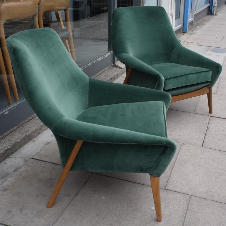 A pair of vintage 1950s British manufactured armchair covered in green ...