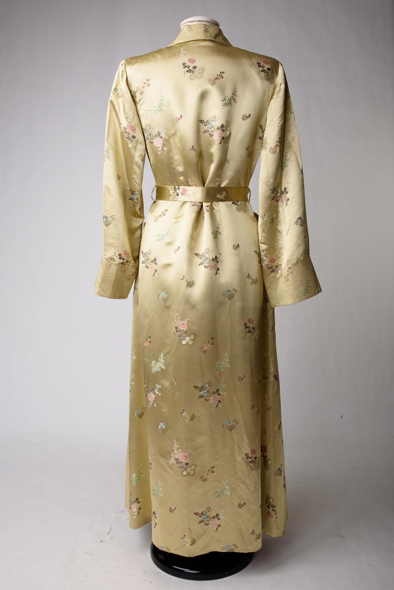 A Pale yellow brocaded satin Interior dressing gown Circa 1940-1950 For ...