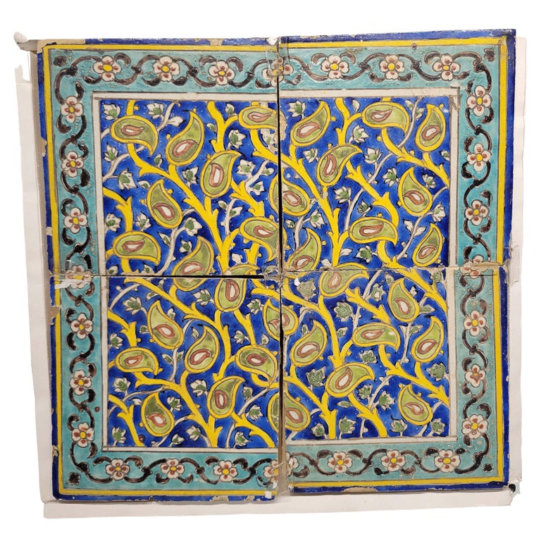 A panel of four late Safavid or Zand cuerda seca tiles, probably ...