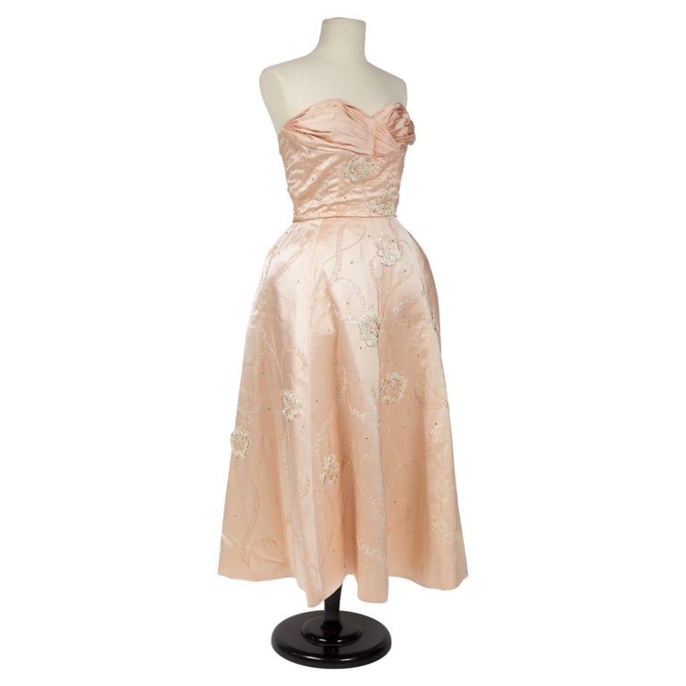 A Satin Embroidered Ball Gown by Harvey Berin Designed by Karen Stark ...