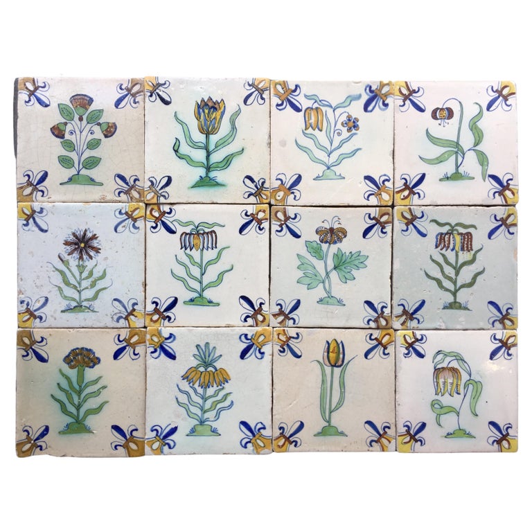 A set of 12 polychrome Dutch Delft tiles with flowers For Sale at 1stDibs