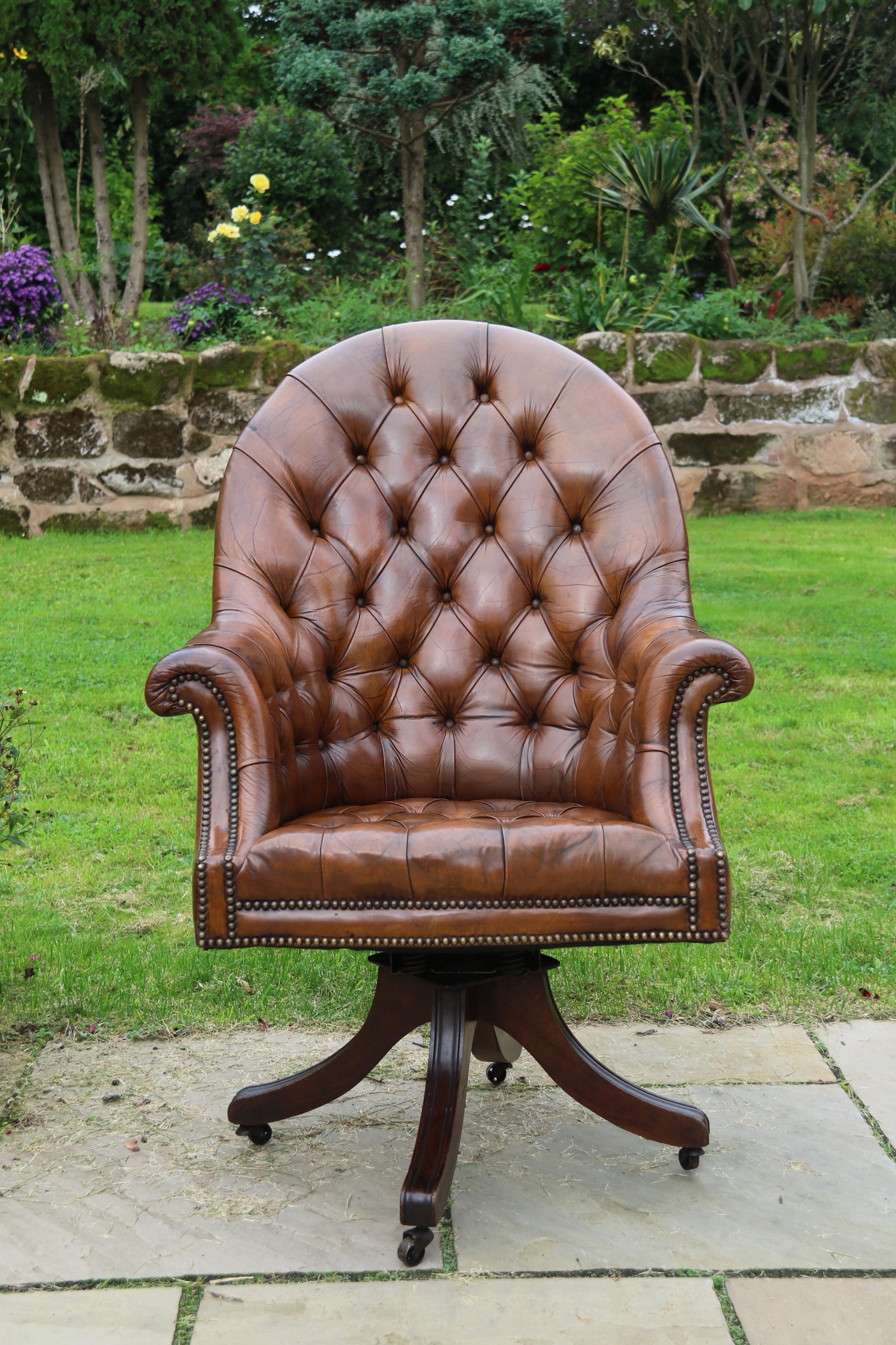A tilt and rotate desk/study armchair upholstered in original leather ...