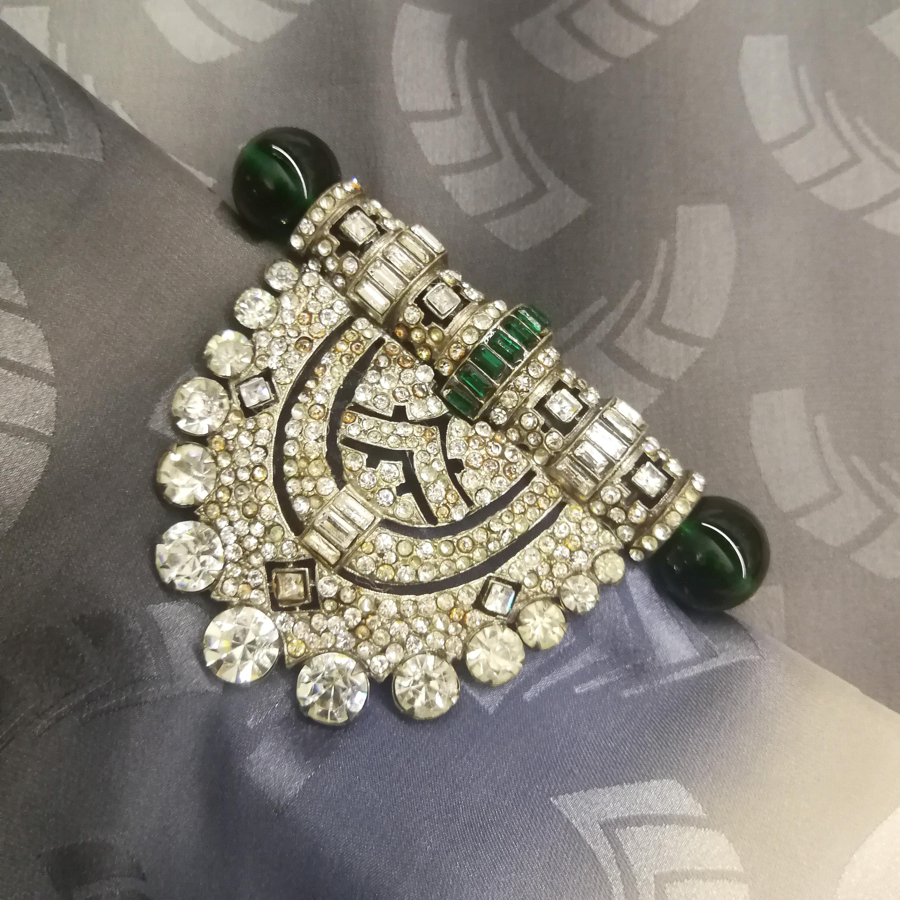 A very large metal, clear and emerald paste Art Deco clip, Renel ...