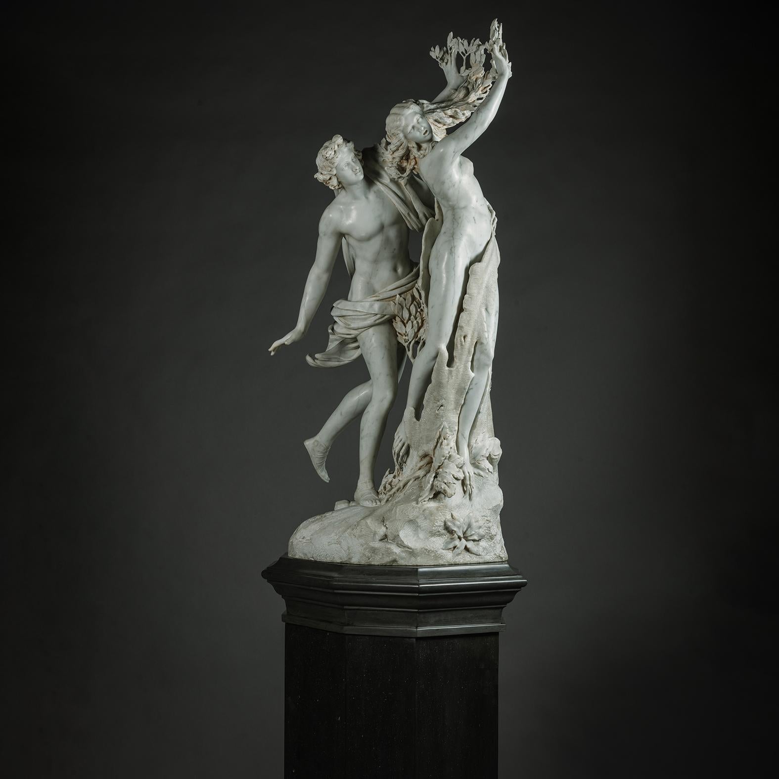 A White Statuary Marble Figural Group of Apollo and Daphne After ...