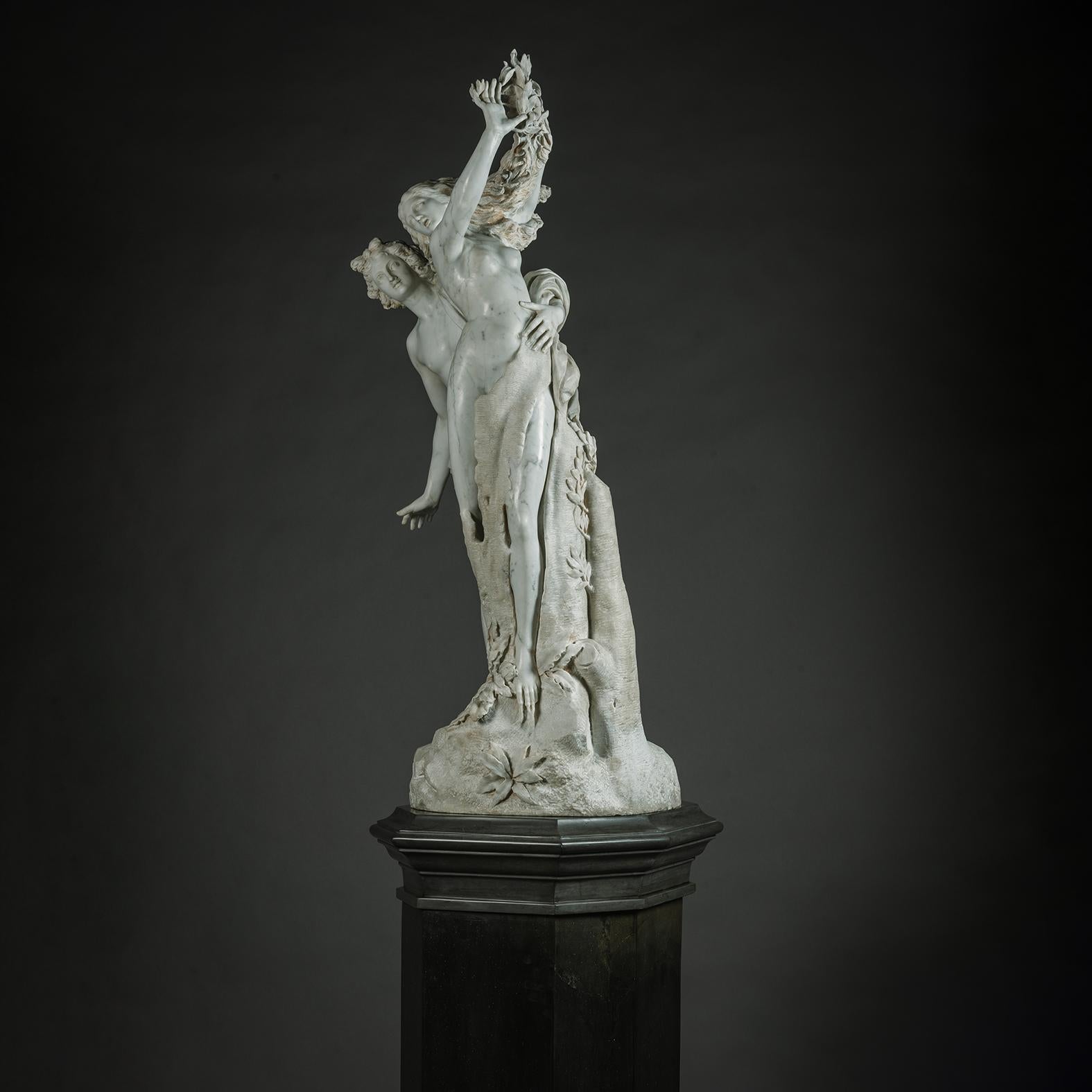 A White Statuary Marble Figural Group of Apollo and Daphne After ...