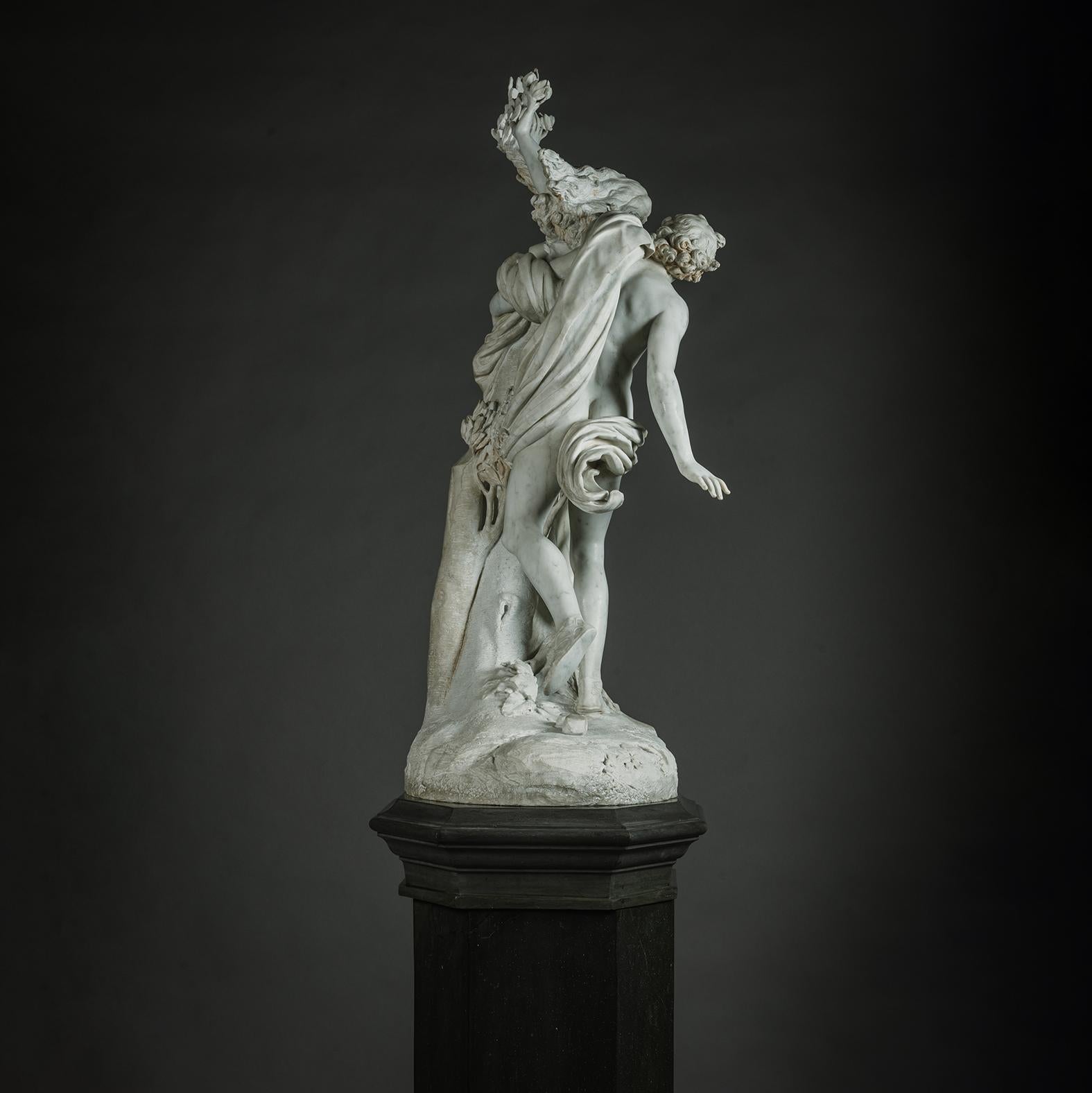 A White Statuary Marble Figural Group of Apollo and Daphne After ...