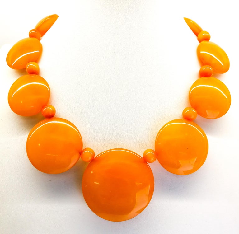 A wonderful orange Bakelite necklace, bangle and ring combination ...