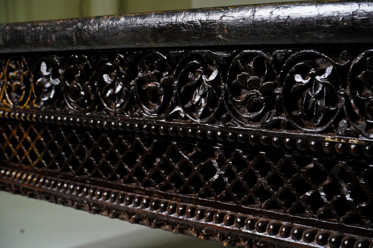A Wooden Indian Daybed with Carved Decoration at 1stDibs