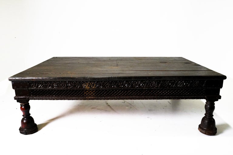 A Wooden Indian Daybed with Carved Decoration at 1stDibs
