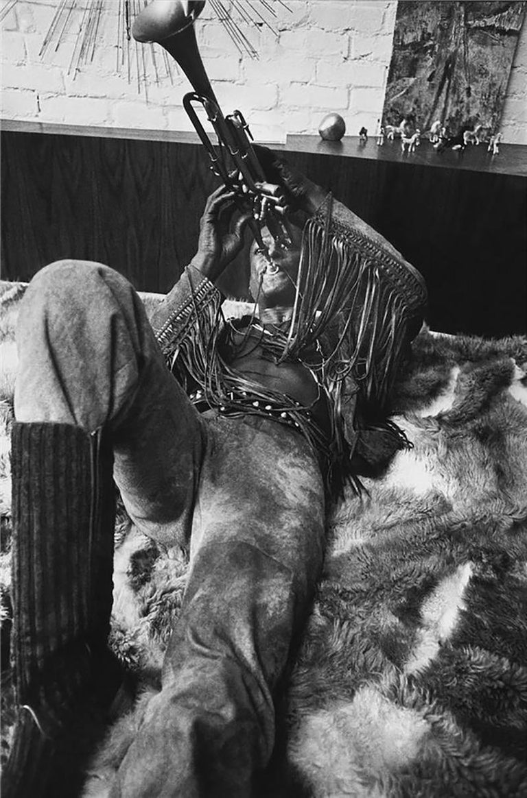 Unknown - Miles Davis, playing trumpet, reclining, 1970 For Sale at 1stDibs