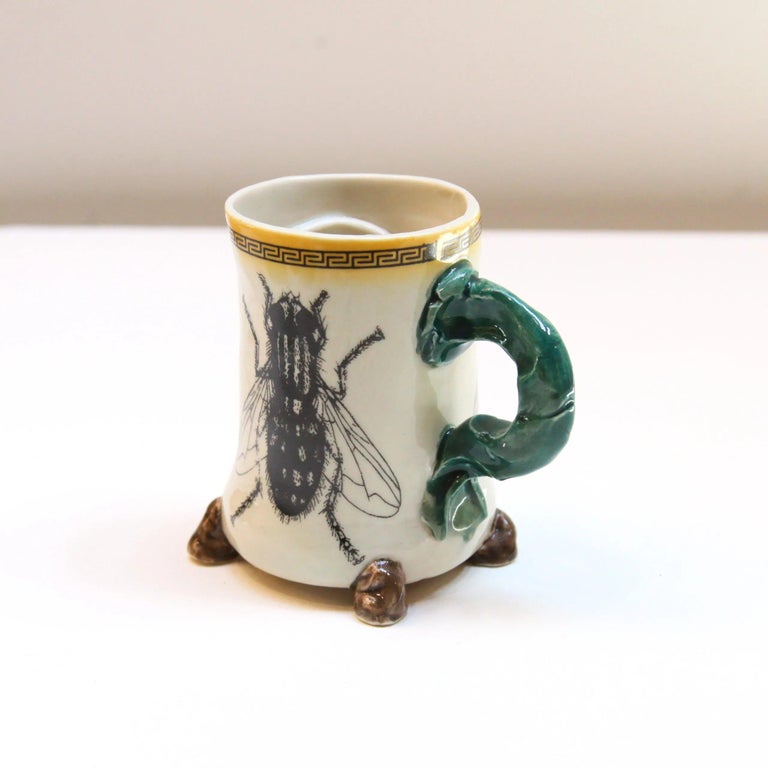 Ron Carlson - Ceramic Pop Culture Man With Hat And Fly Cup For Sale at ...