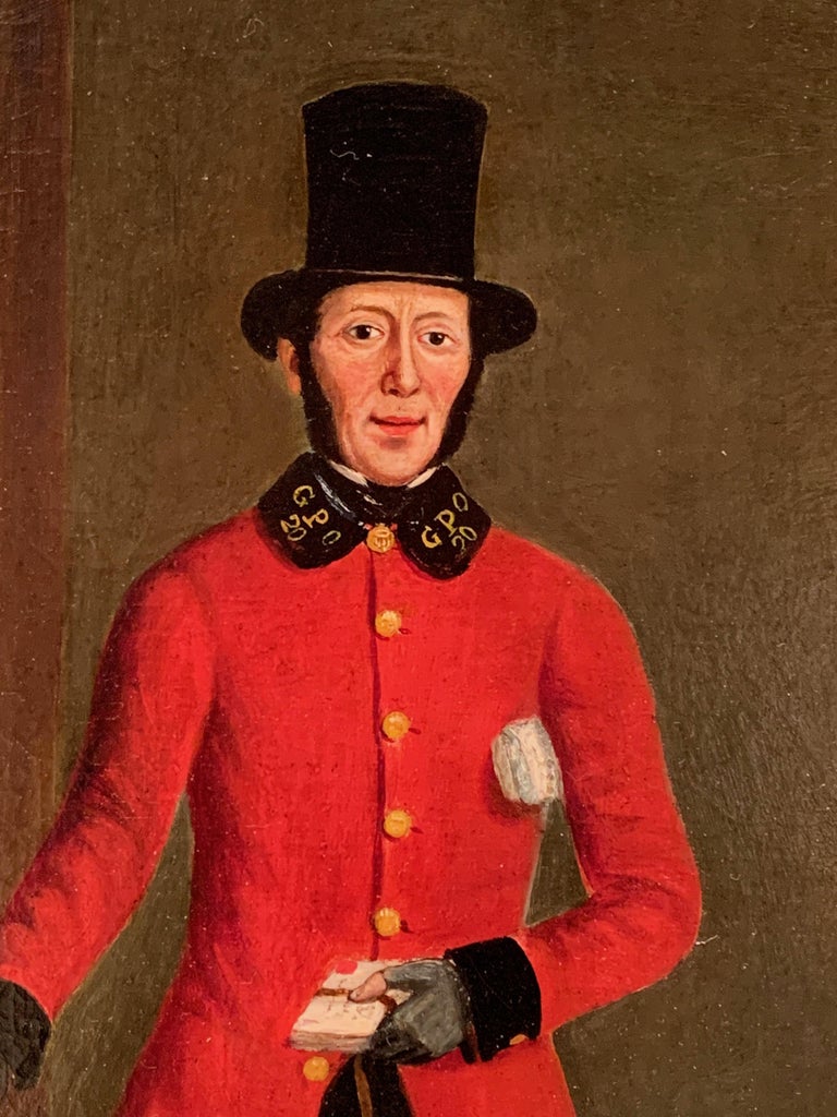 English portrait of a mid 19th century Postman in red jacket, holding ...