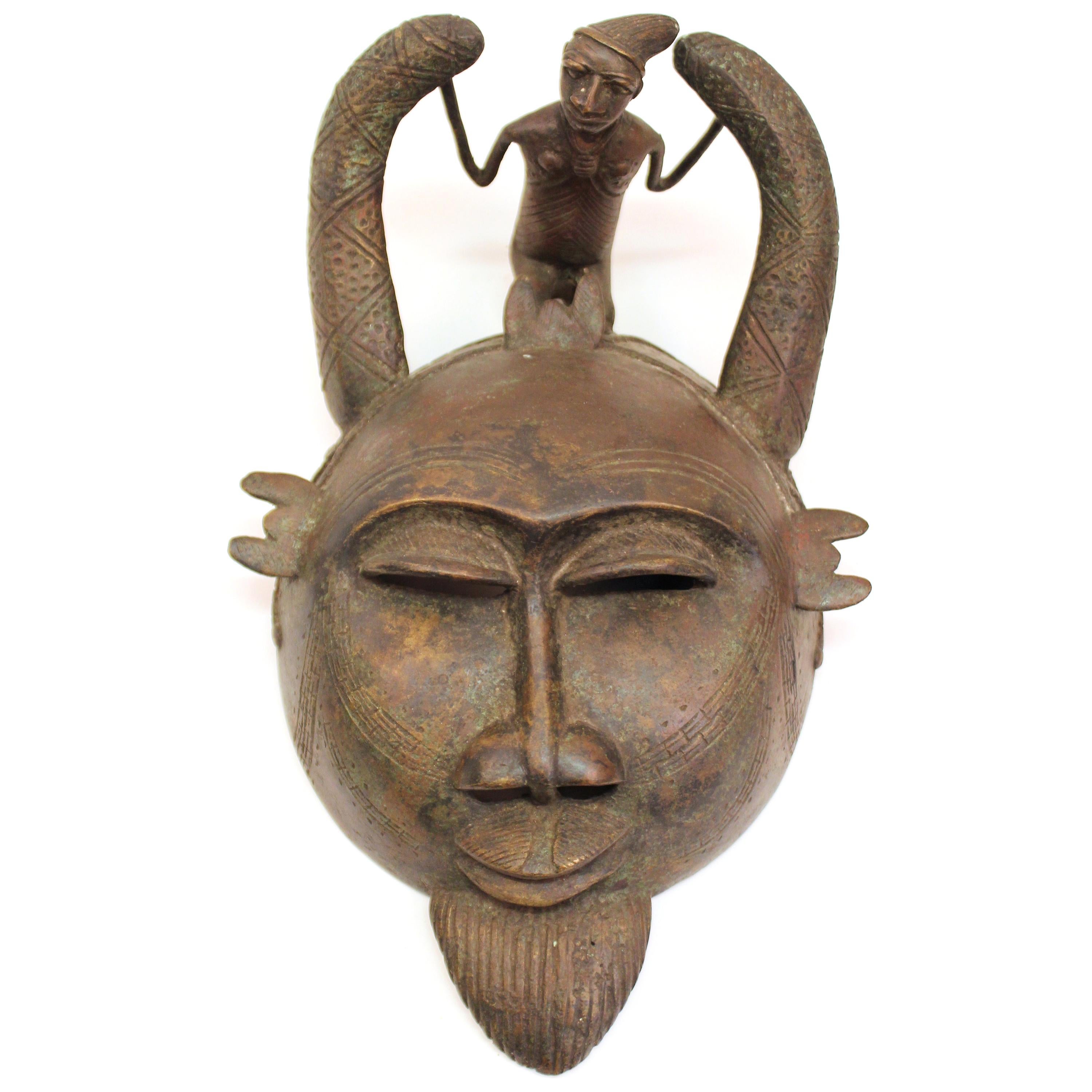 Carved African Hand Carved Gabon Female Mask from Punu Gabon For Sale ...