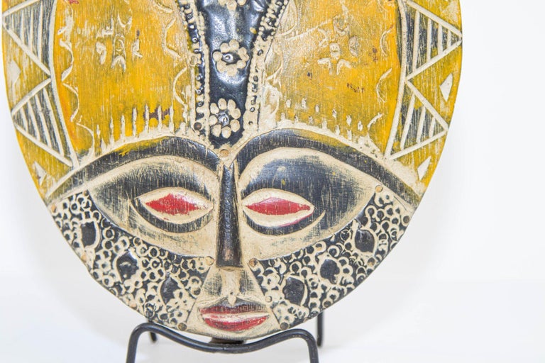 African Wood Decorative Mask Mounted on a Metal Stand For Sale at 1stDibs