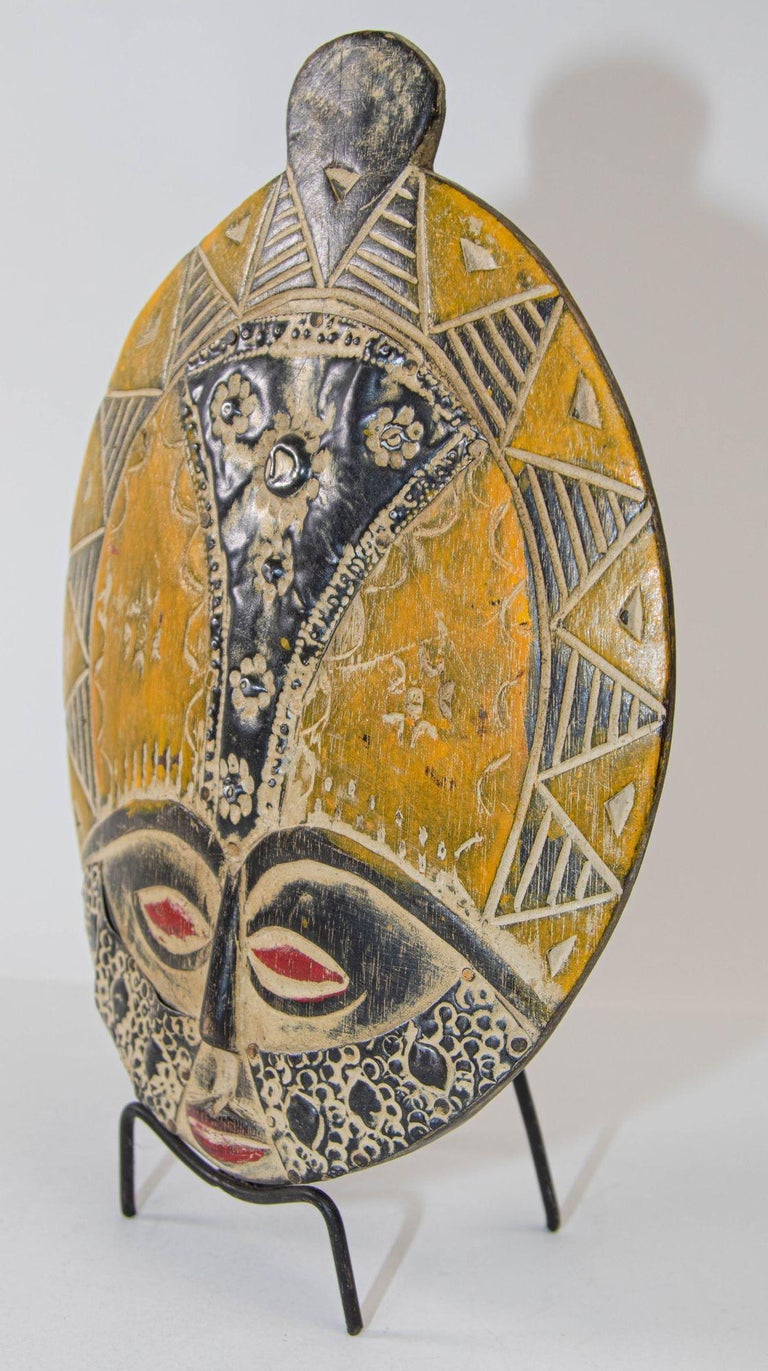 African Wood Decorative Mask Mounted on a Metal Stand For Sale at 1stDibs