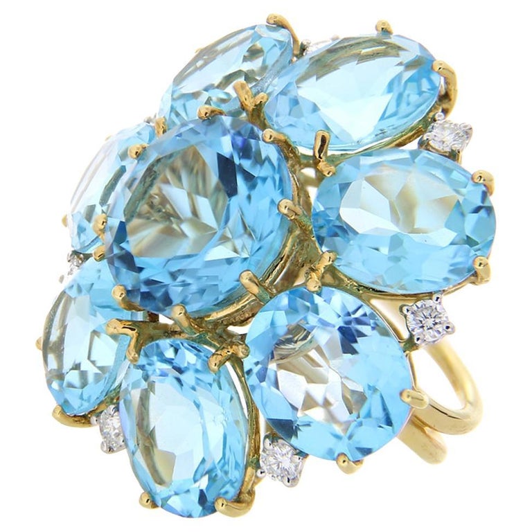 AIG, bague fleur en or jaune 18 carats avec topaze bleue et diamants blancs de 50 carats En ...