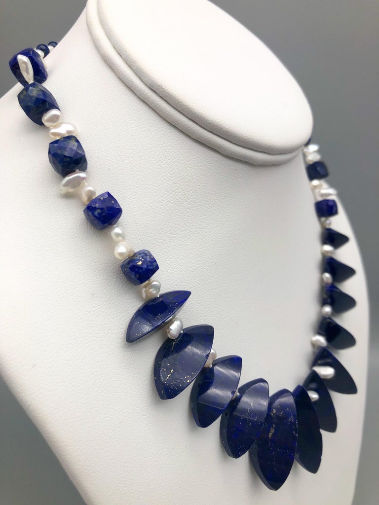 A.Jeschel Unusually cut Lapis beads are strung in a flattering necklace ...