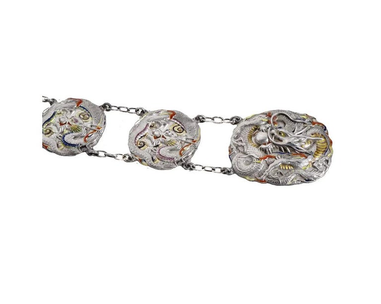 An antique Japanese Meiji period repousse silver belt consisting of ...