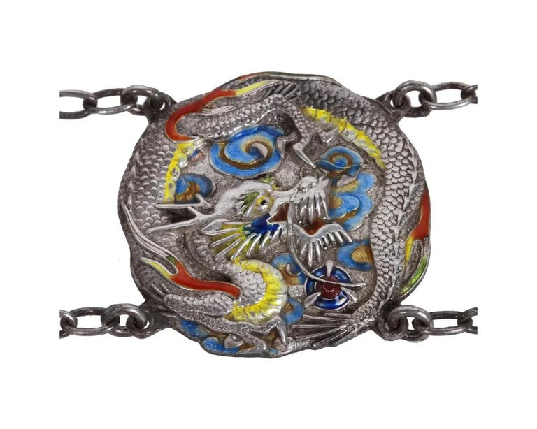 An antique Japanese Meiji period repousse silver belt consisting of ...
