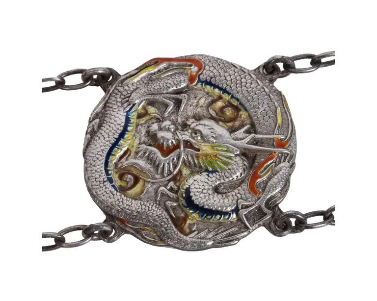 An antique Japanese Meiji period repousse silver belt consisting of ...