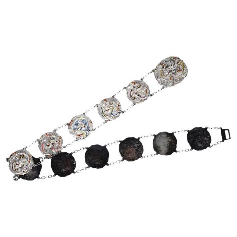 An antique Japanese Meiji period repousse silver belt consisting of ...