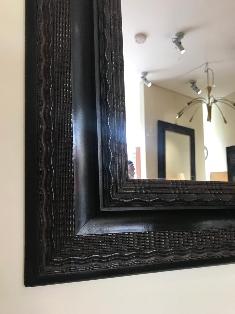 Ebonised Carved Ripple Frame Flemish Style Mirror at 1stDibs