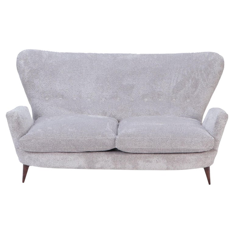 An Italian vintage wingback drop arm upholstered settee. For Sale at ...