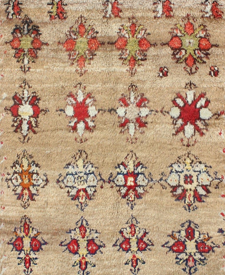 Angora Turkish Tulu Carpet with Colorful Floral Designs Set on Sand ...